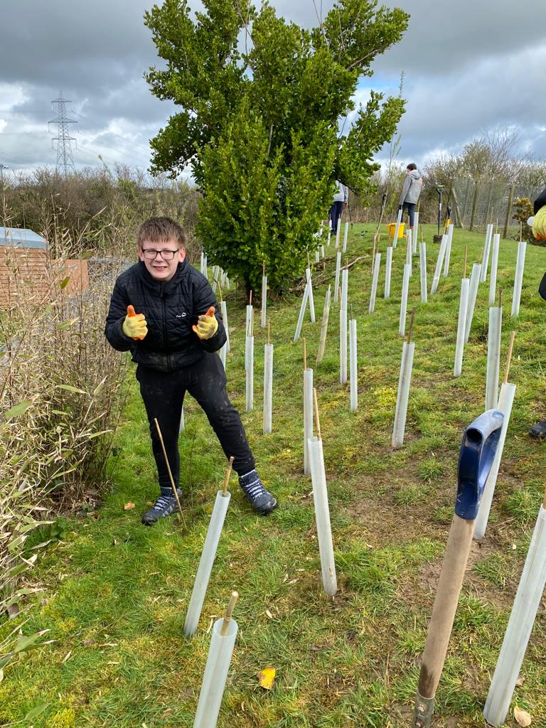 Volunteers help with tree planting efforts • Folly Farm