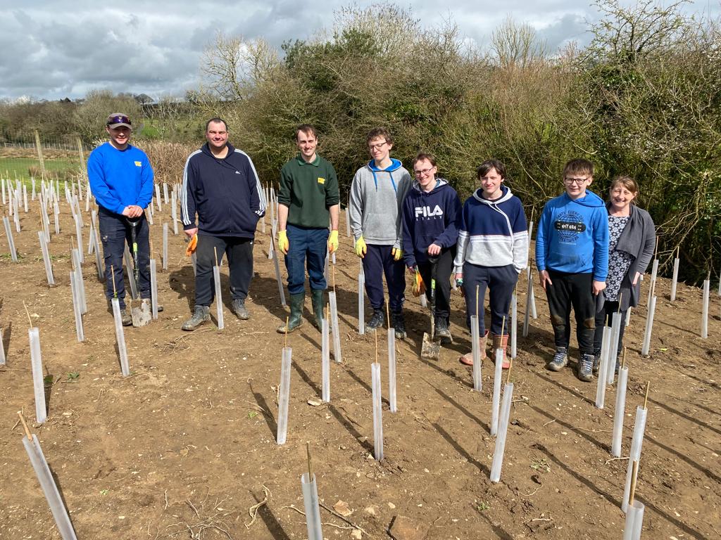 Volunteers help with tree planting efforts • Folly Farm